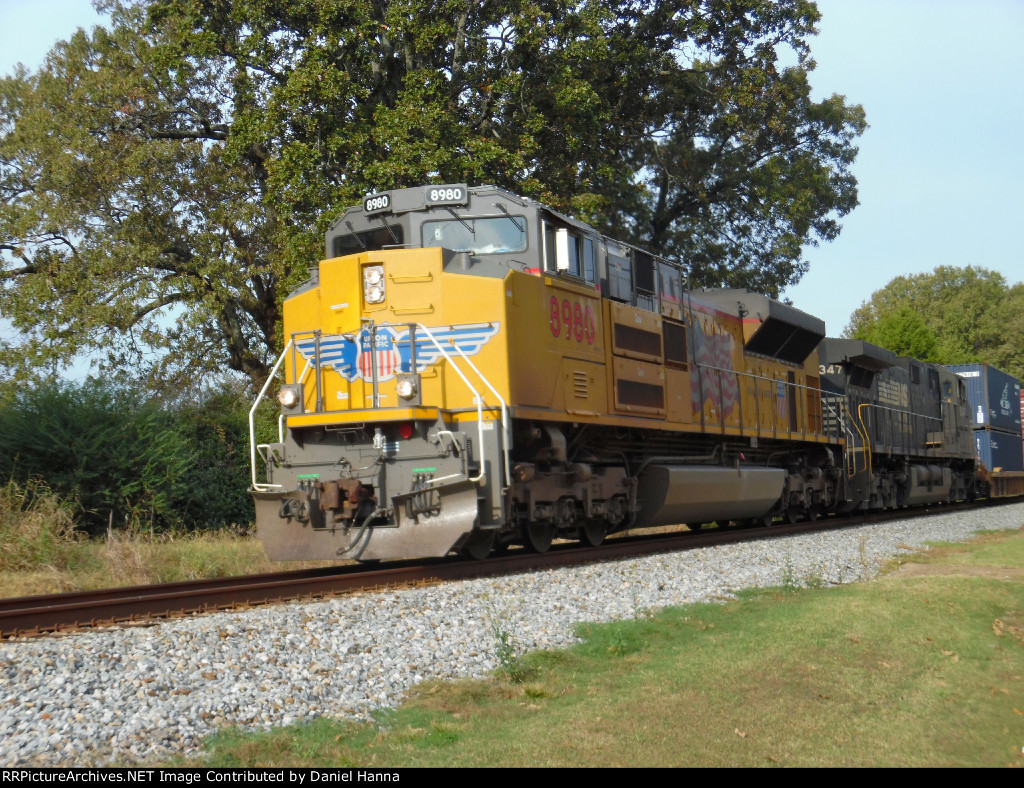 22N heads east with a UP SD70AH in the lead
